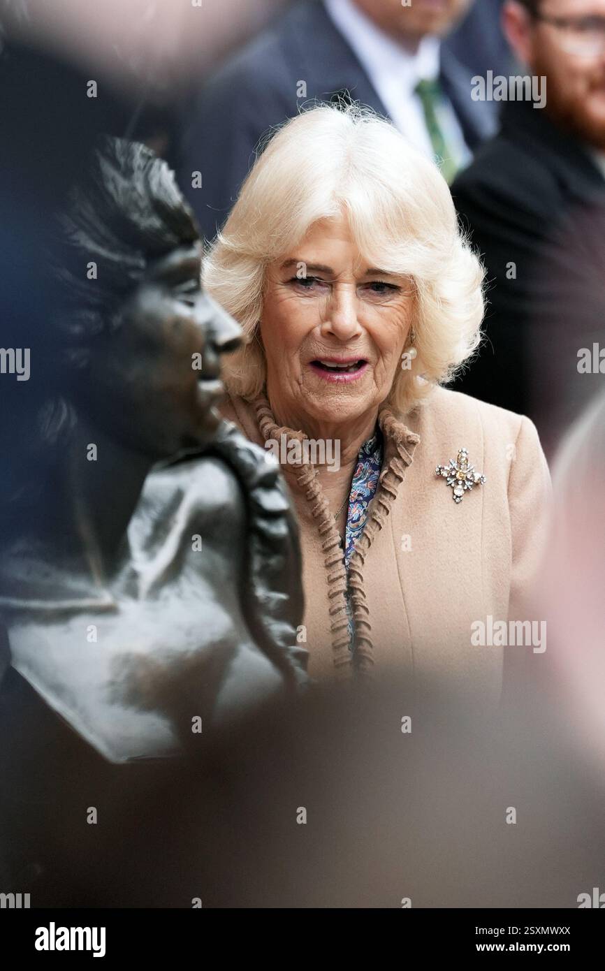 Queen Camilla unveils a life-size bronze statue of Canterbury-born ...