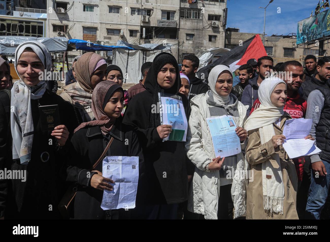 Palestinian students take part in a protest to demand the opening of ...