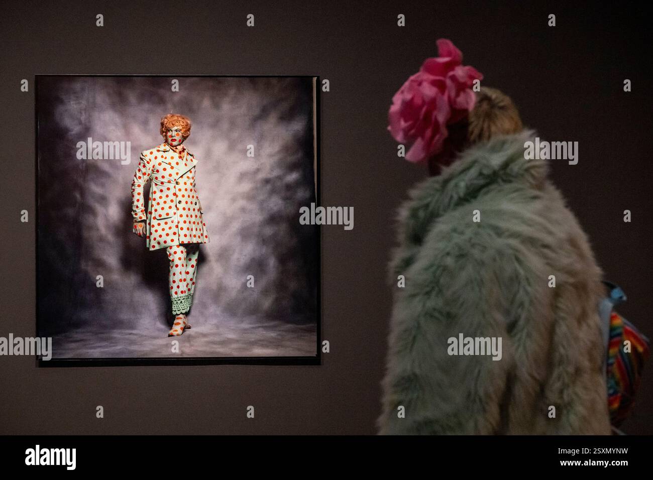 London, UK. 25 February 2025. A visitor with an image in the Session ...