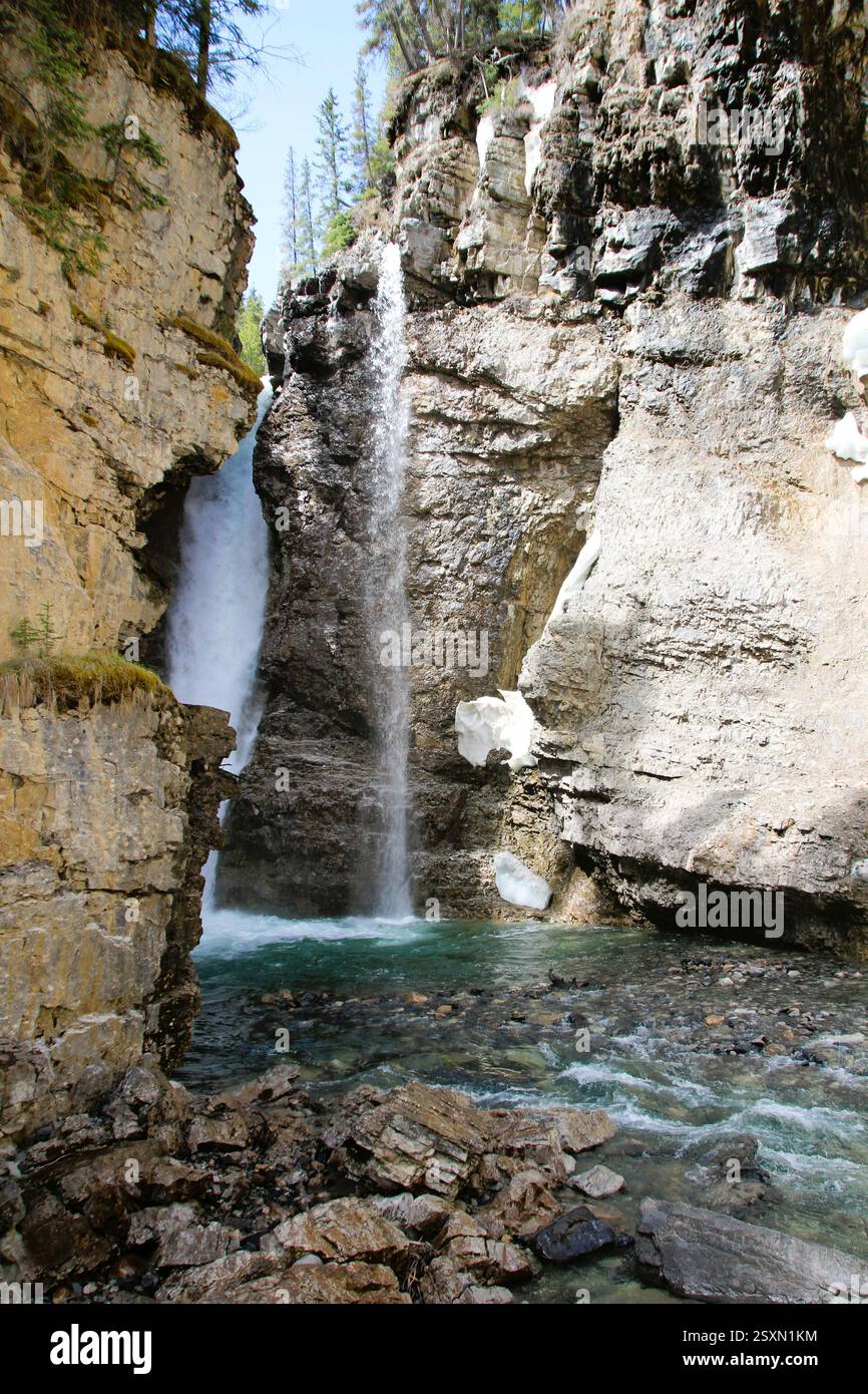 The photo captures a stunning natural scene featuring a waterfall ...