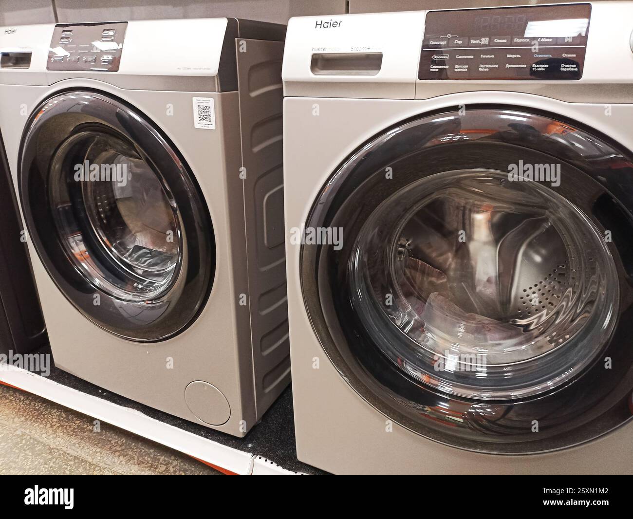Modern front-load washing machines in appliance store display Stock ...
