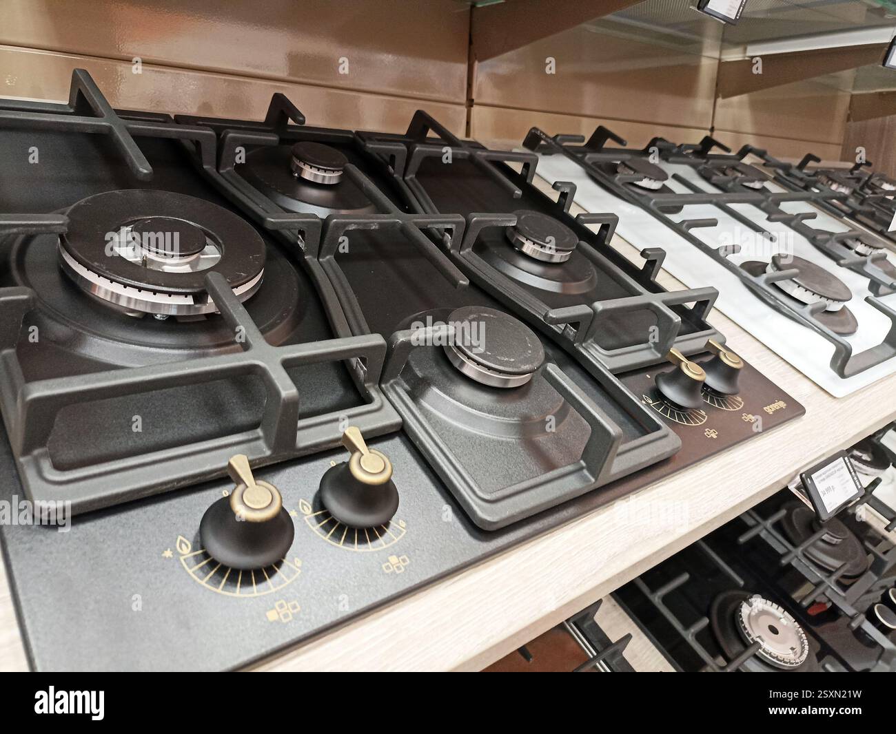 Modern gas stovetops displayed in kitchen appliance store Stock Photo ...