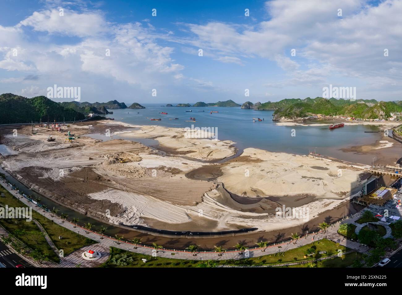 Aerial view of the filling of Cat Ba Bay with sand as part of the ...