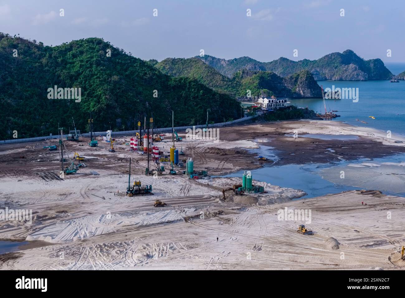 Filling the bay of Cat Ba with sand as part of the construction work of ...