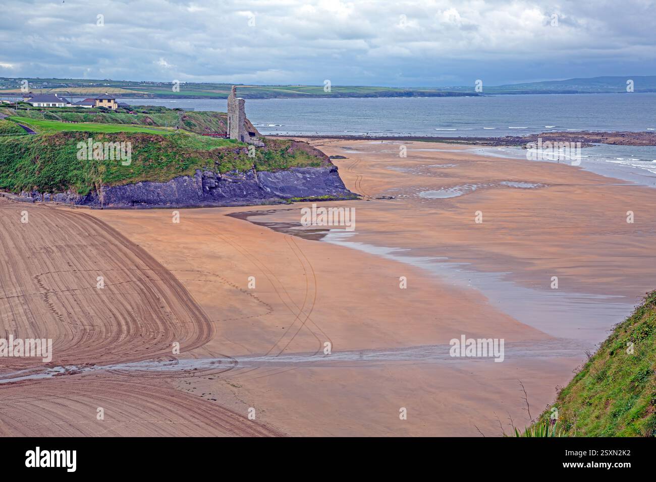 Golden sand and rugged cliffs at Ballybunion Beach in Ireland during ...