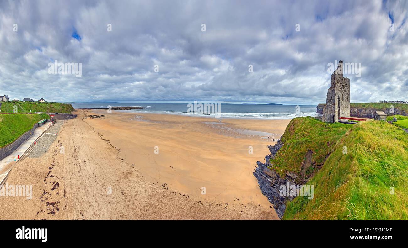 Golden sand and rugged cliffs at Ballybunion Beach in Ireland during ...