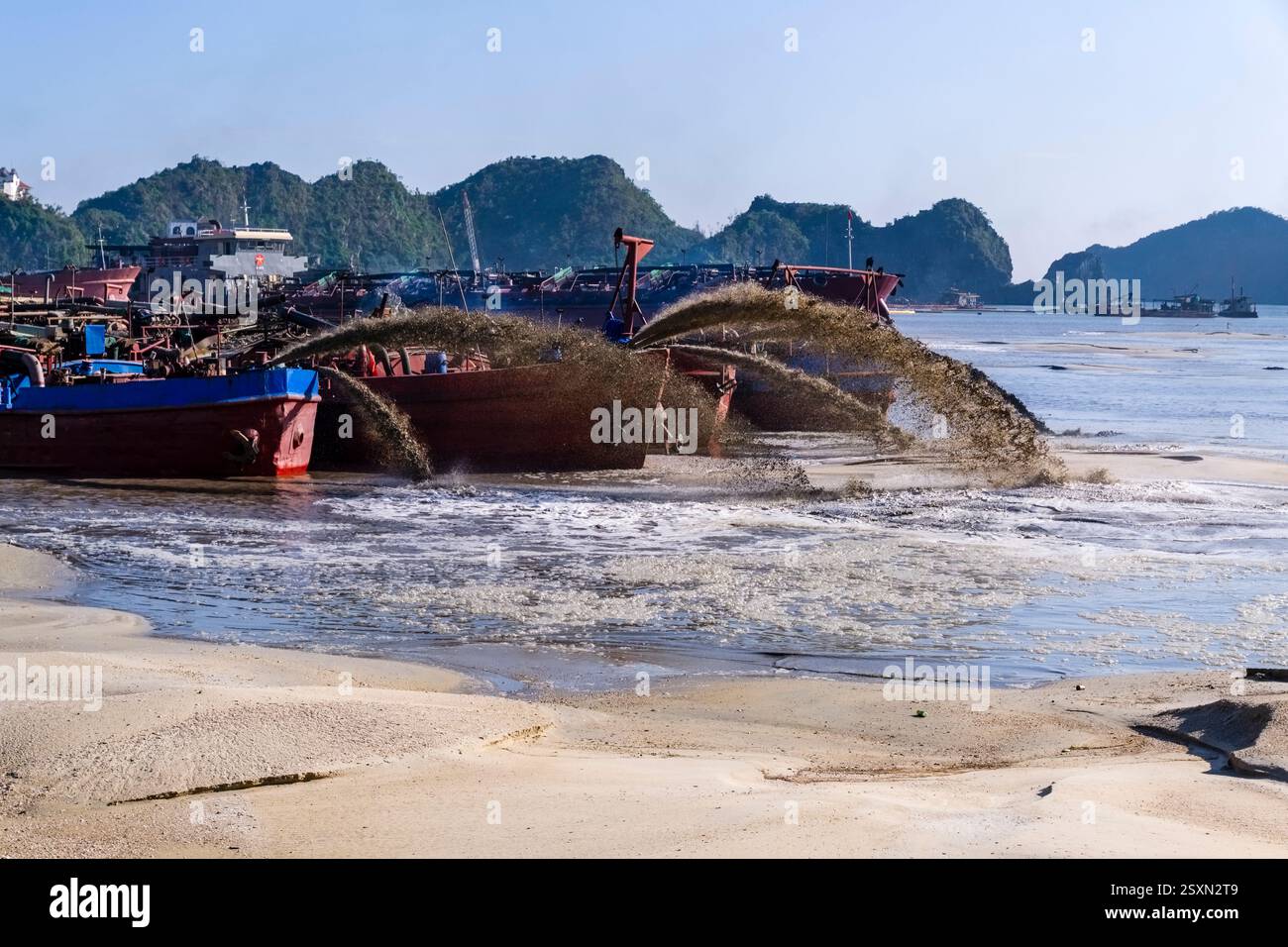 Filling the bay of Cat Ba with sand as part of the construction work of ...