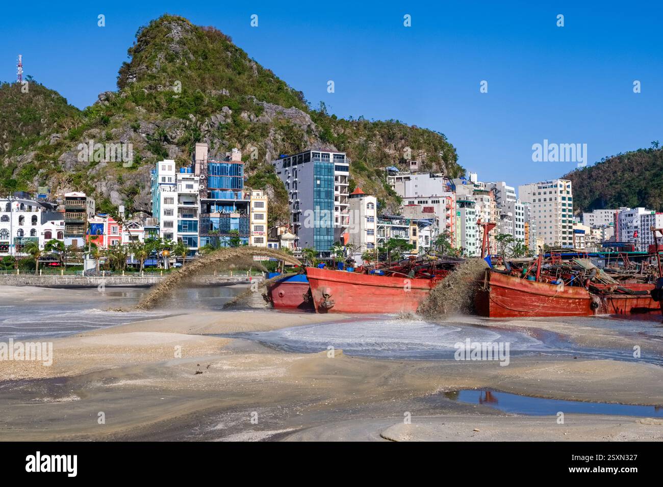Filling the bay of Cat Ba with sand as part of the construction work of ...