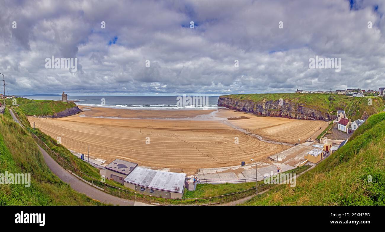 Golden sand and rugged cliffs at Ballybunion Beach in Ireland during ...