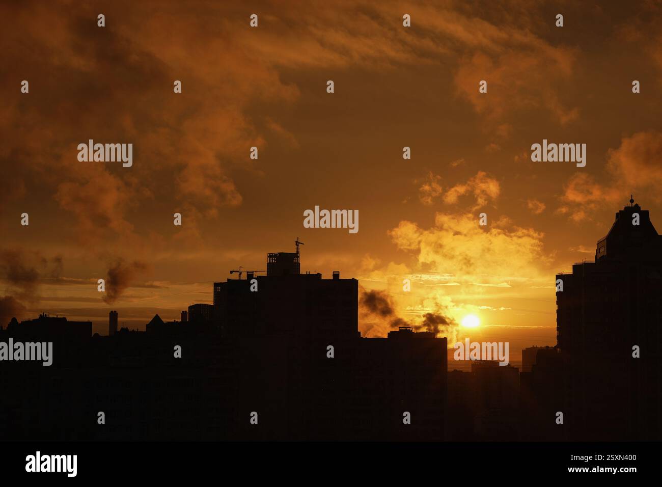 Colorful sunset over buildings. Night sity scene Stock Photo - Alamy