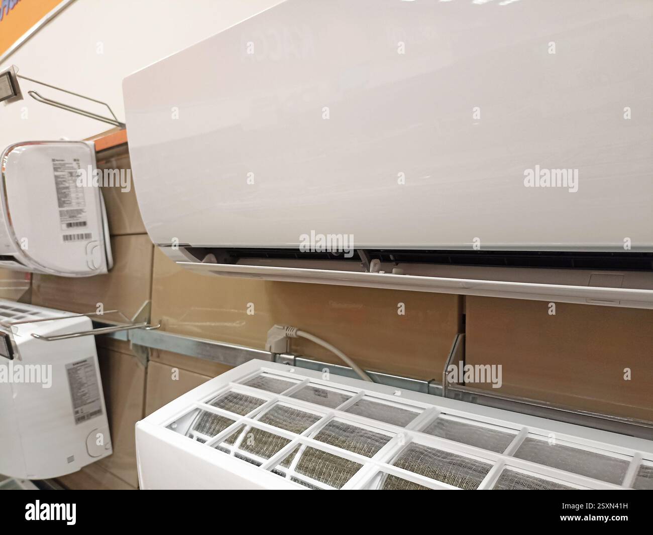 Wall-mounted air conditioning units displayed in store Stock Photo - Alamy
