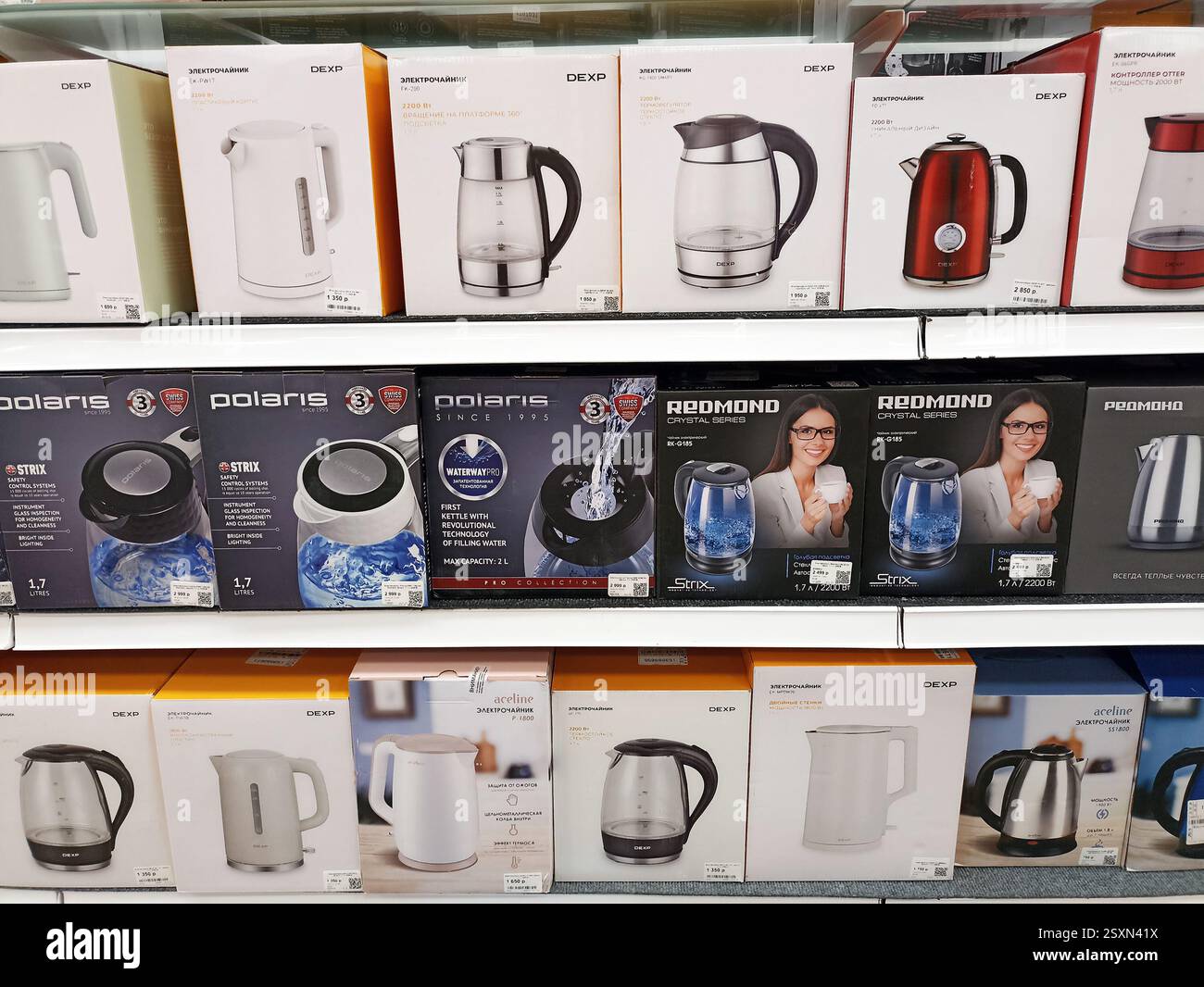 Variety of electric kettles on store shelf with packaging display Stock ...