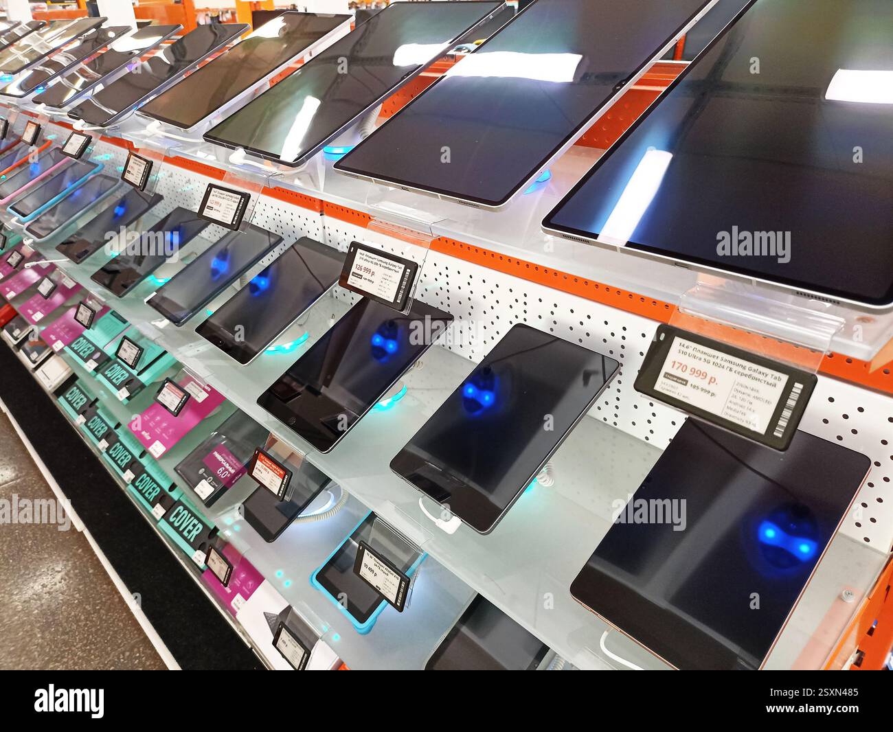Variety of tablets on display in electronics store Stock Photo - Alamy