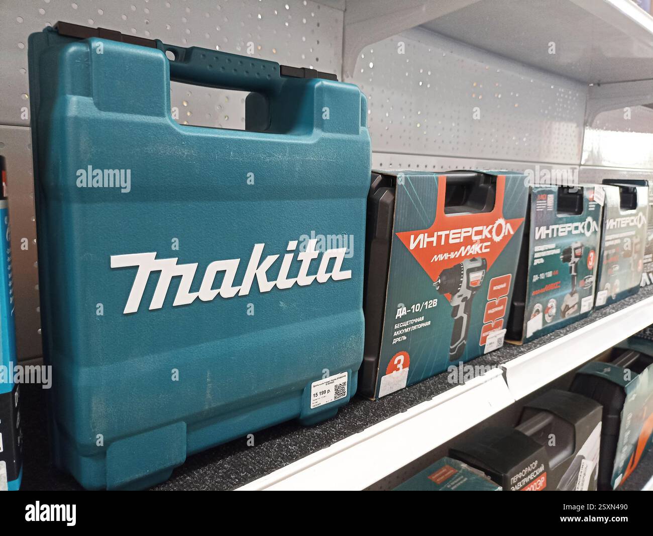 Makita power tool case on store shelf with various branded boxes ...