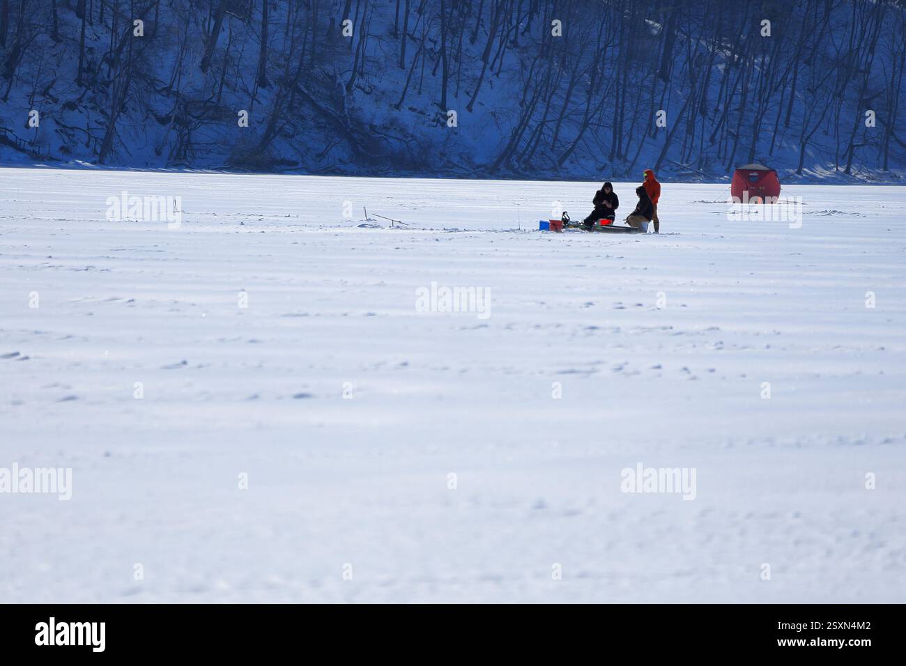 Webster, NY, USA - February 22nd 2025 - Ice fishermen fishing with no ...