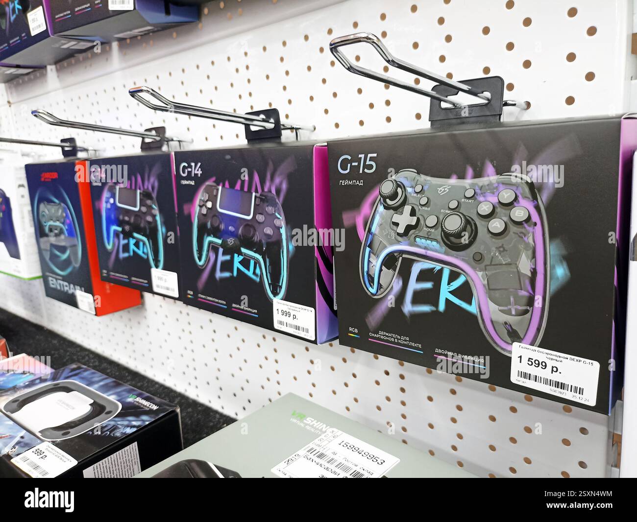 Gaming controllers displayed on store shelf with graffiti-style ...