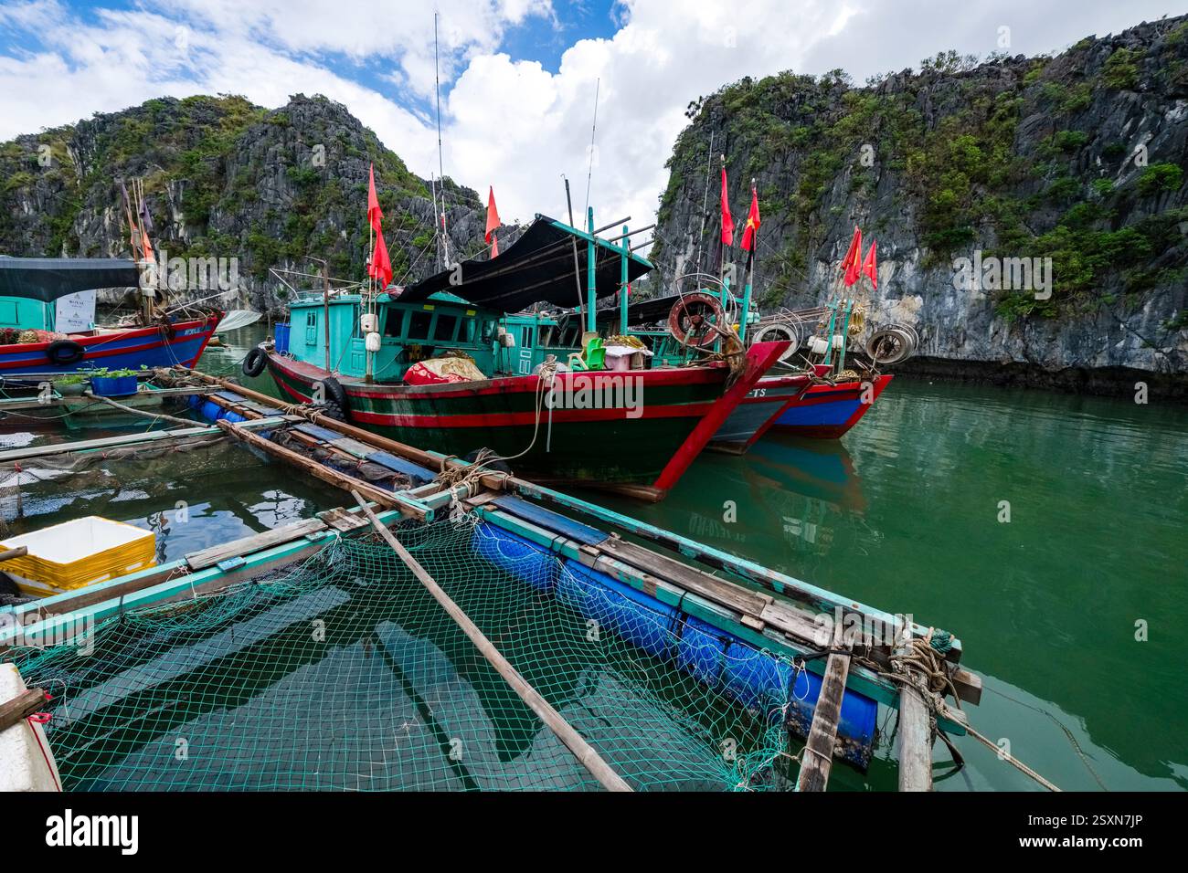 Fishing boats in Cai Beo fishing village, the biggest ancient fishing ...