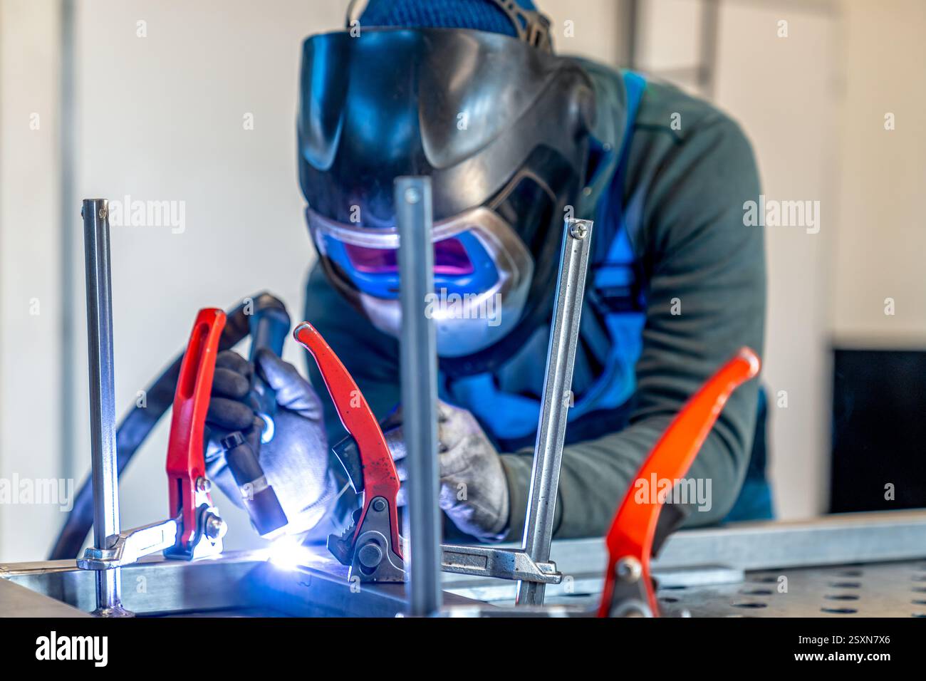 Welder joining metal components using migmag welding technique Stock ...