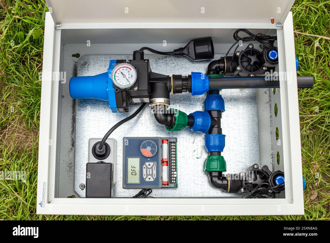 Installation of drip irrigation system. Setting up and assembling the ...