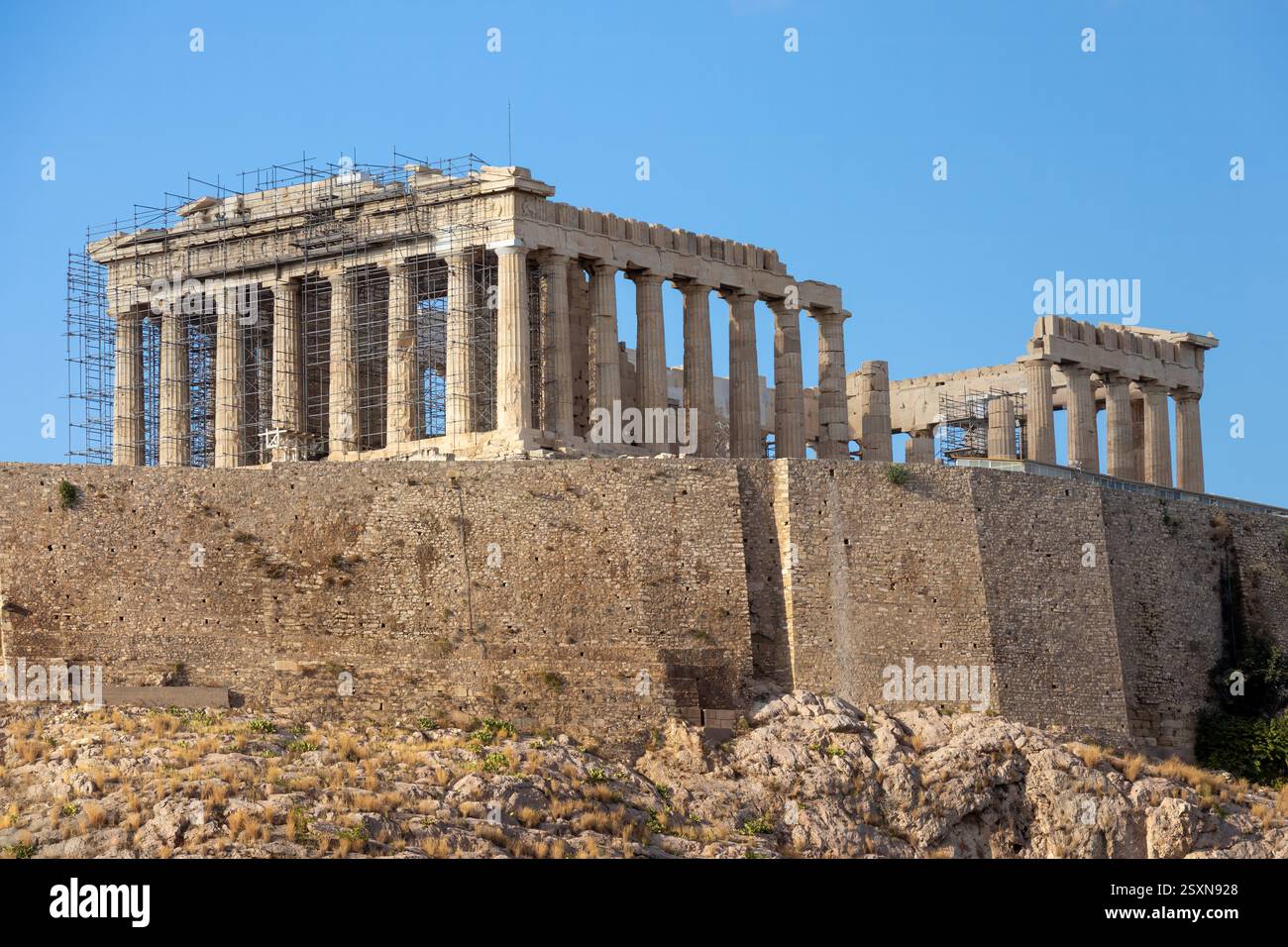 The Parthenon, part of the Acropolis of Athens. Situated on a rocky ...