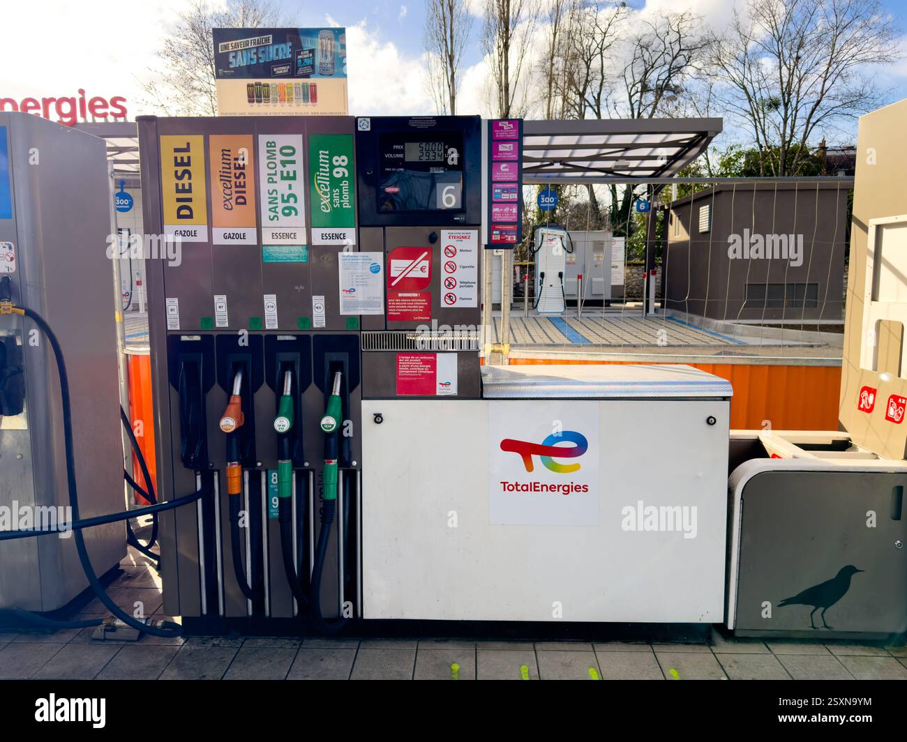 Fueling up at a modern gas station in a vibrant urban setting Stock ...