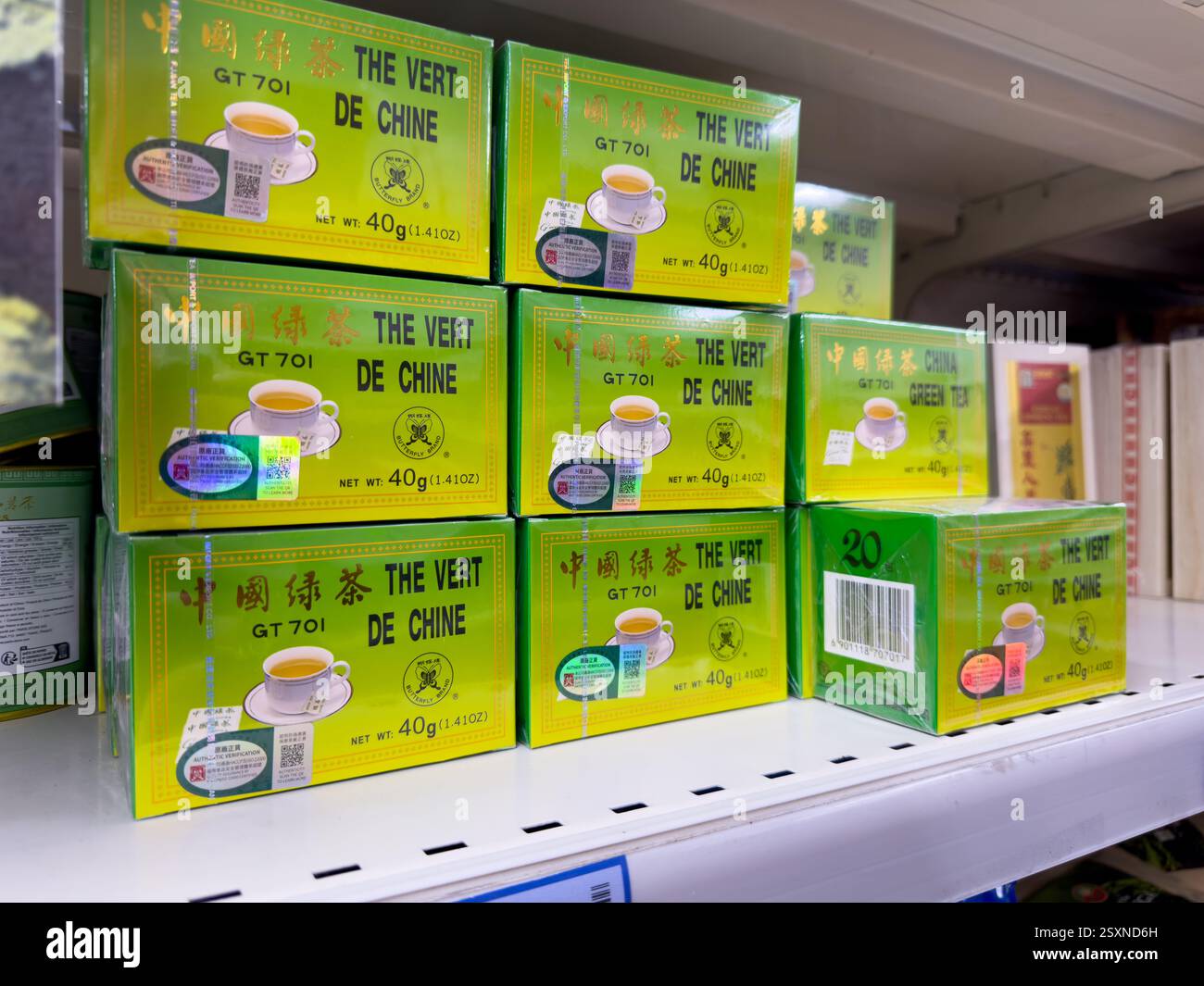 China green tea boxes lined up in a colorful display at a market Stock ...