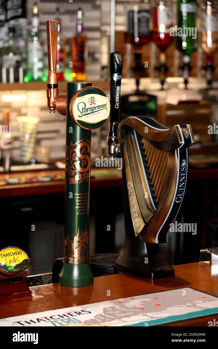 Bar pumps pictured at the Hardy’s Pub in Dorchester, Dorset, UK Stock ...