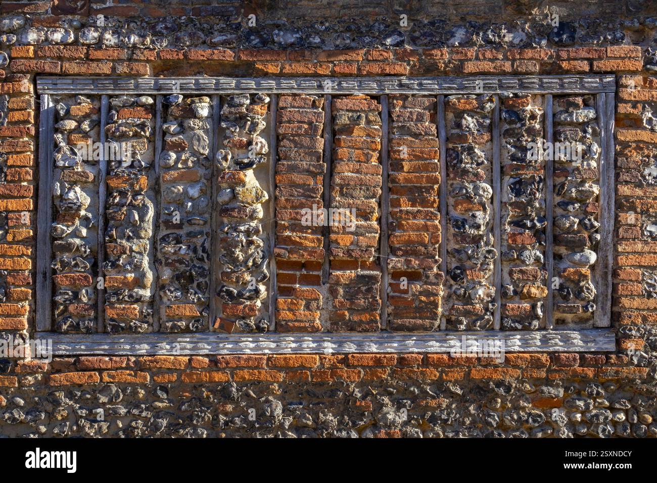 Decorative brickwork showing a framed arrangement of flints and ...