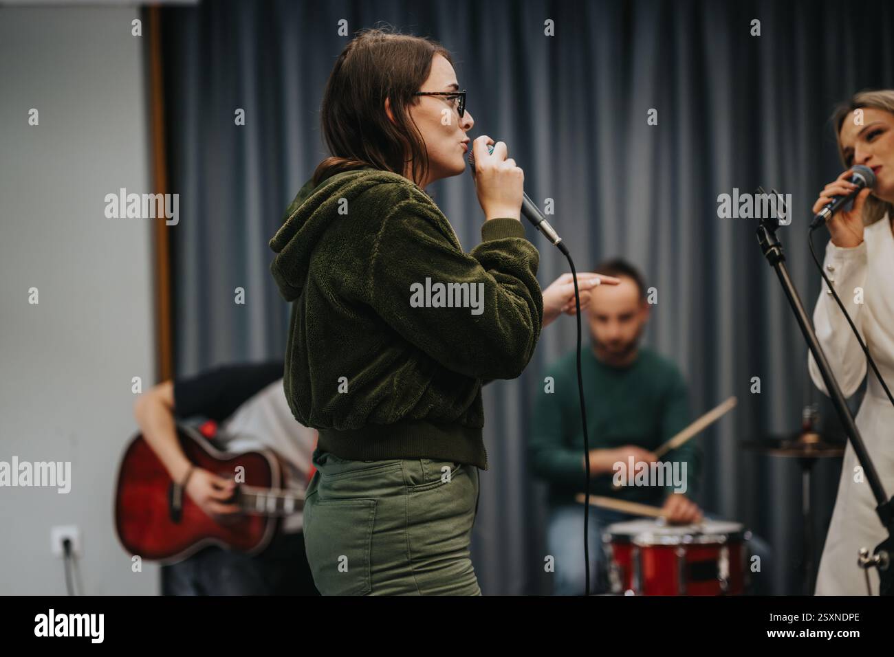 Group of Musicians Rehearsing Together in a Music Studio Setting Stock ...