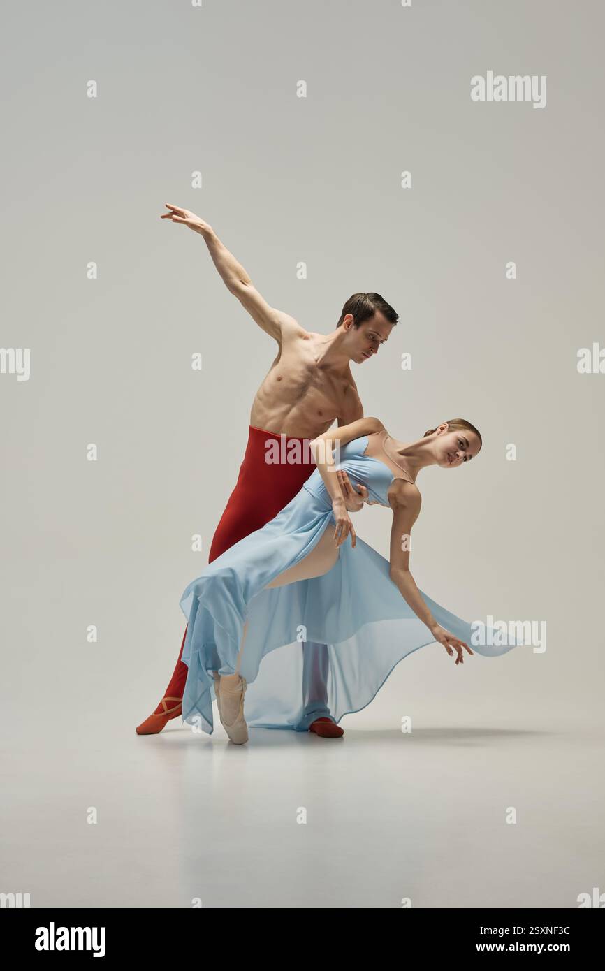 Male and female ballet dancers performing expressive movement, arms ...