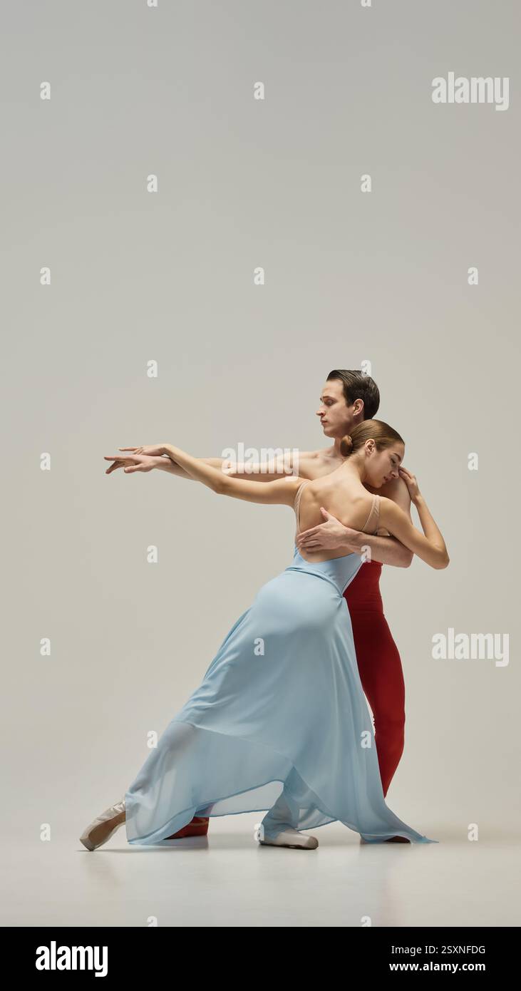 Ballet dancers holding each other in tender embrace, movement frozen in ...