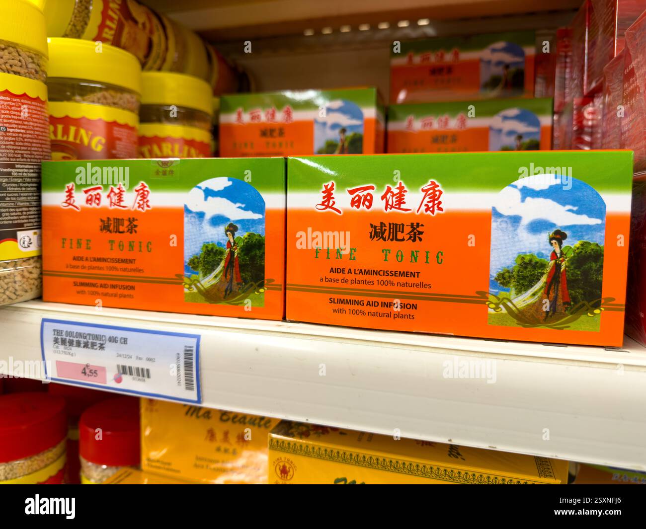 Herbal tea box displaying vibrant design in a bustling market aisle ...