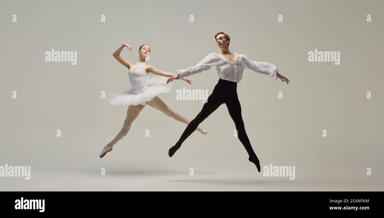 Dynamic photo of young ballet dancers in expressive leap, his flexible ...