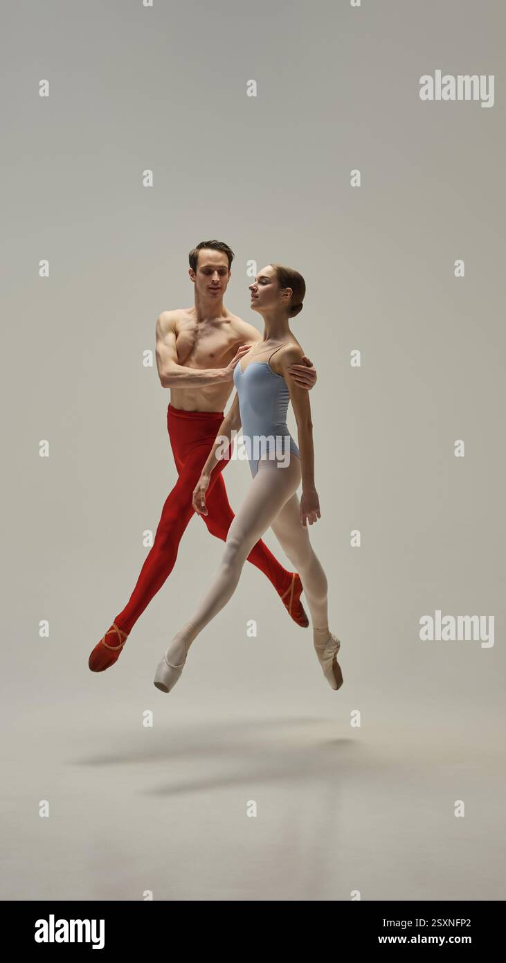 Dynamic photo of young ballet duo, athletic man and woman, leaping in ...