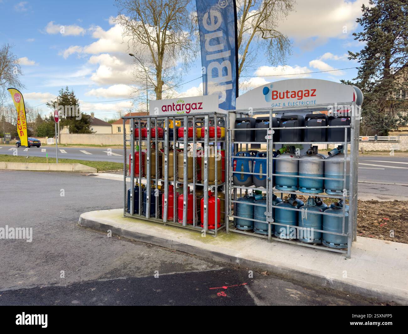 Gas canisters on display at a bustling roadside station Stock Photo - Alamy