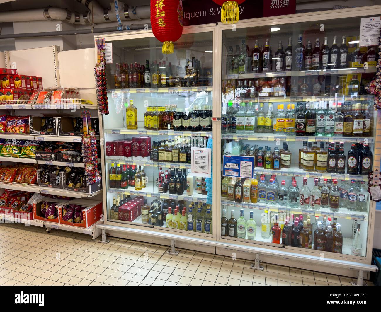 Variety of bottles in a well-stocked liquor store during afternoon ...
