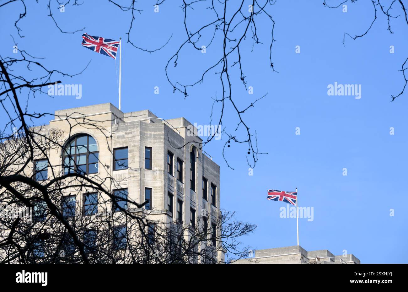 London, UK. Union Flags flying from the roof of the Adelphi Building in ...