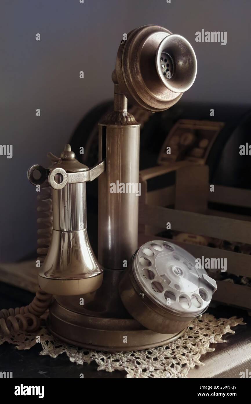Close up of a vintage candlestick telephone with a rotary dial ...