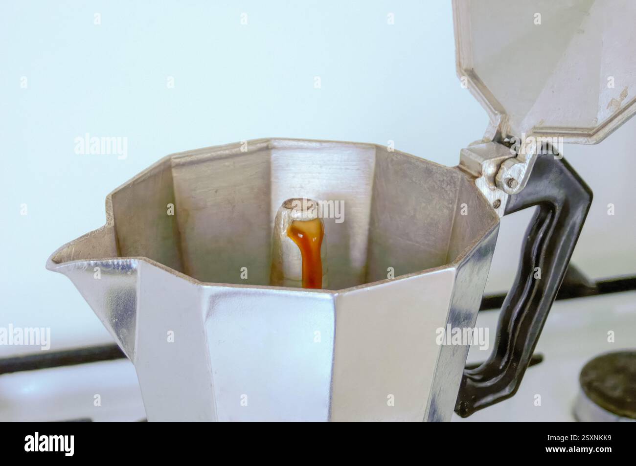 Close up of a neapolitan coffee maker brewing espresso coffee on a ...