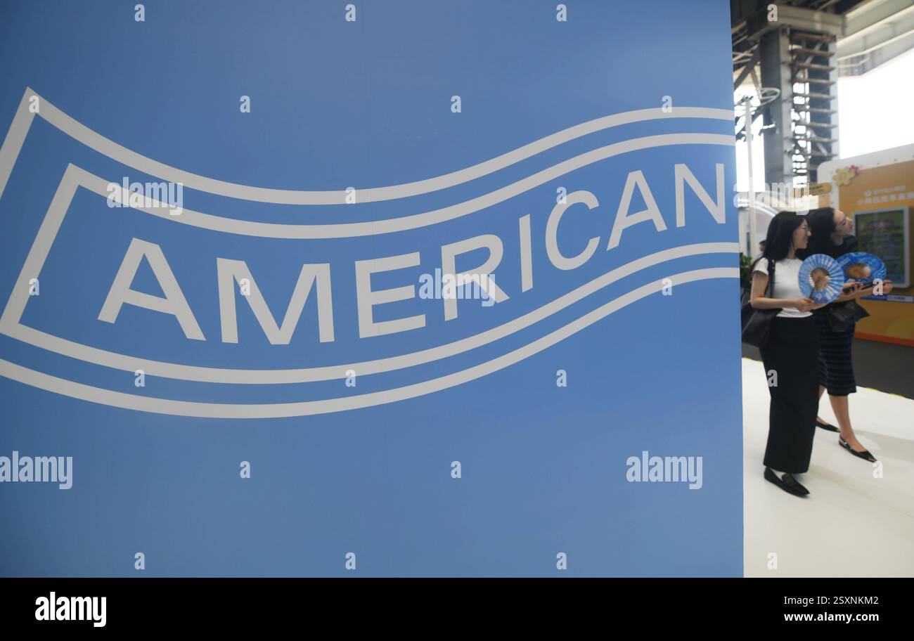 (FILE) Visitors visit the American Express booth at the 2024 INCLUSION ...