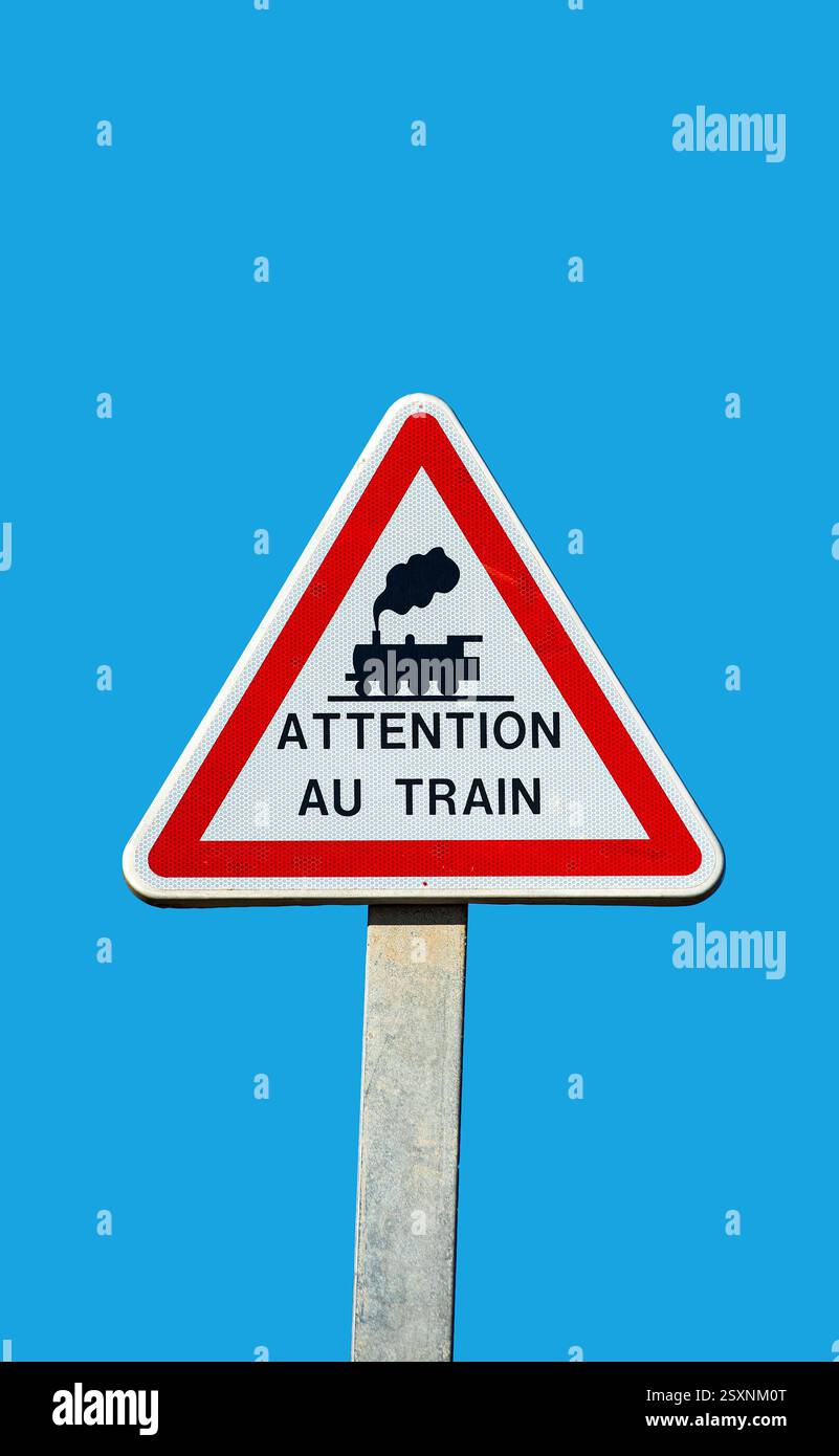 Beware of the train sign in French on a post Stock Photo - Alamy
