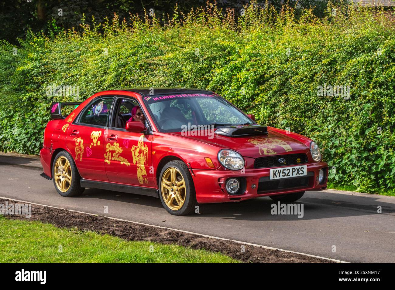2002 custom Red Subaru Impreza GX AWD being driven in the historic ...