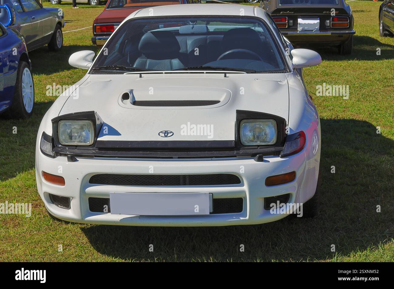 Front view of a white toyota celica gt four st205 parked on a grass ...
