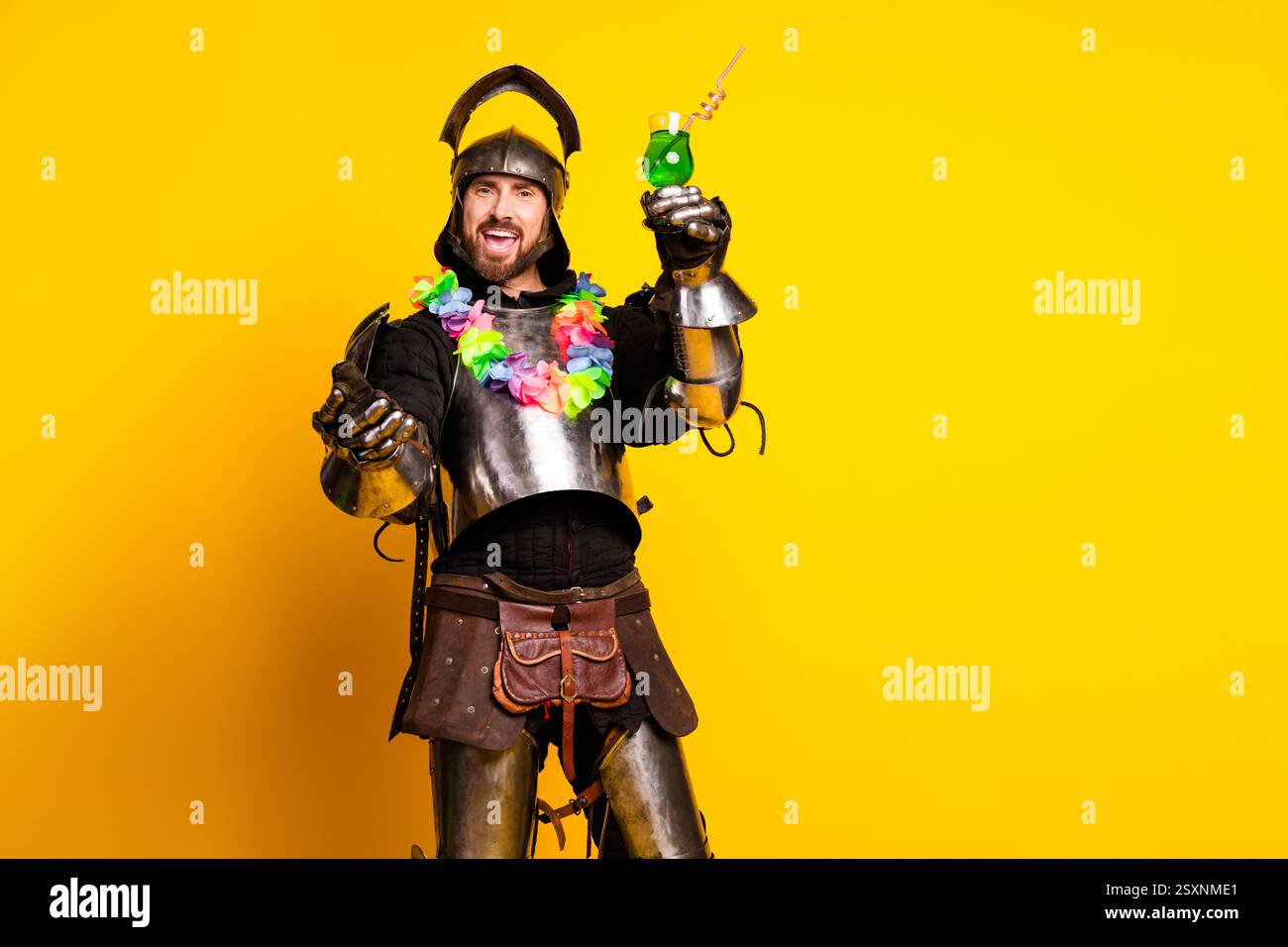 Medieval Knight in Armor Celebrating with a Drink in Front of a Yellow ...
