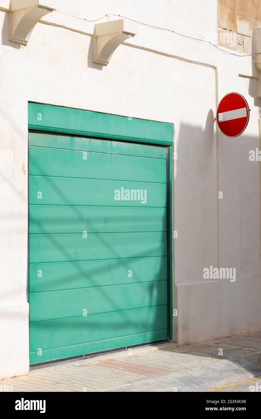 Green garage door and no-entry sign on a backstreet in Sliema, Malta ...
