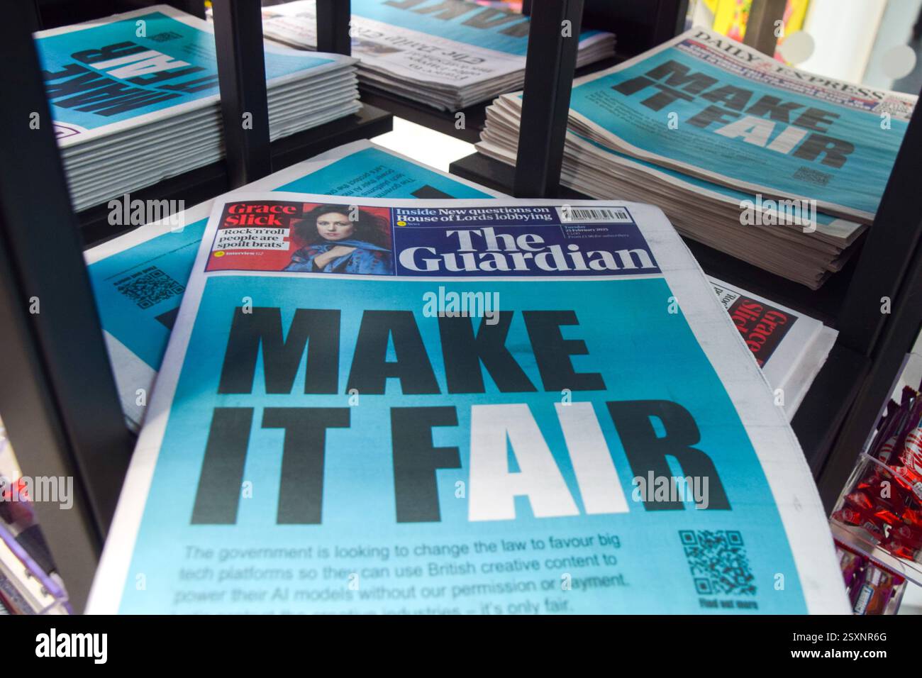 February 25, 2025, London, England, UK: Make It Fair adorns the front pages of The Guardian and ...