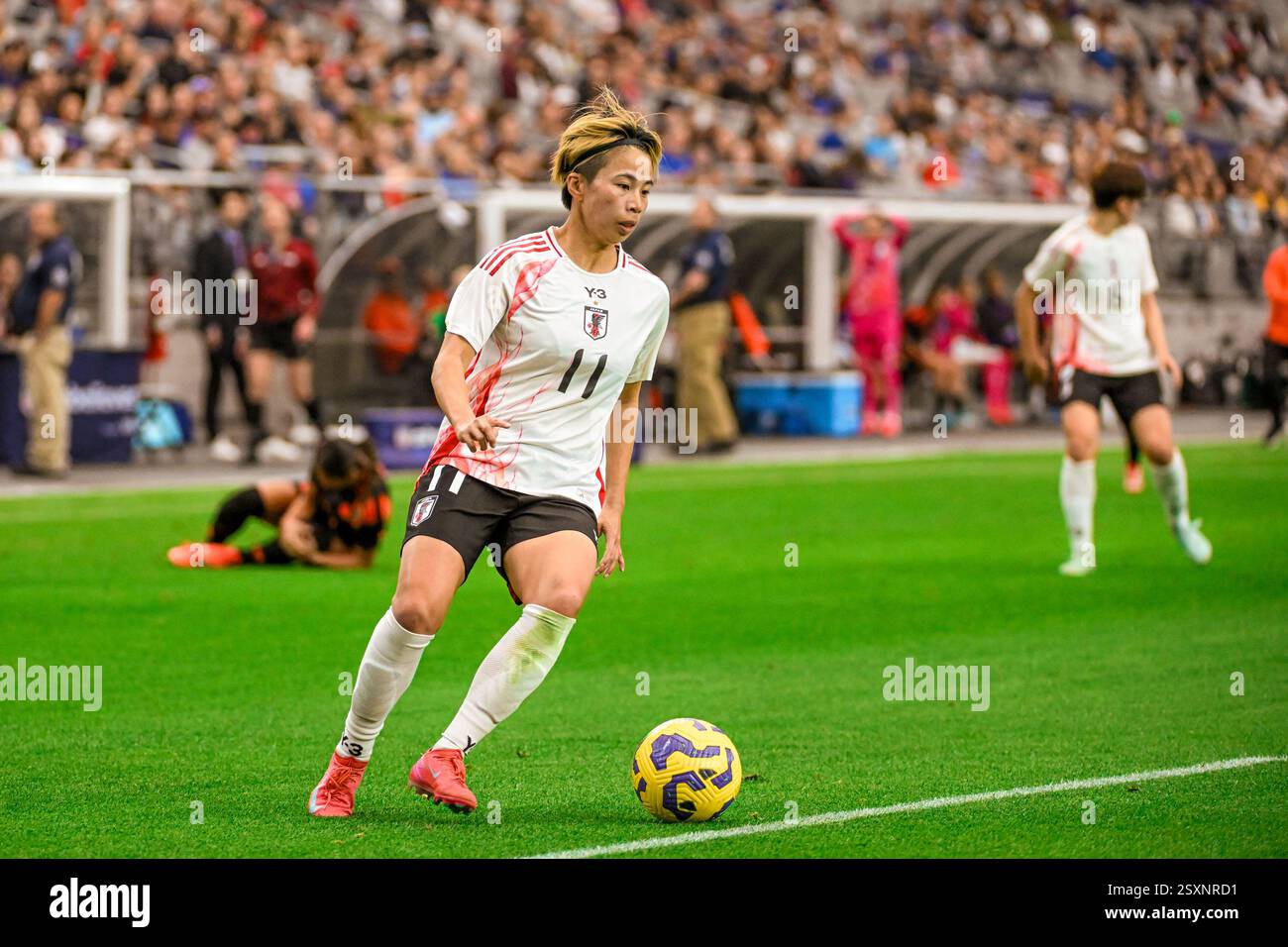 Japan forward Mina Tanaka (11) saves the ball in the first half of the ...
