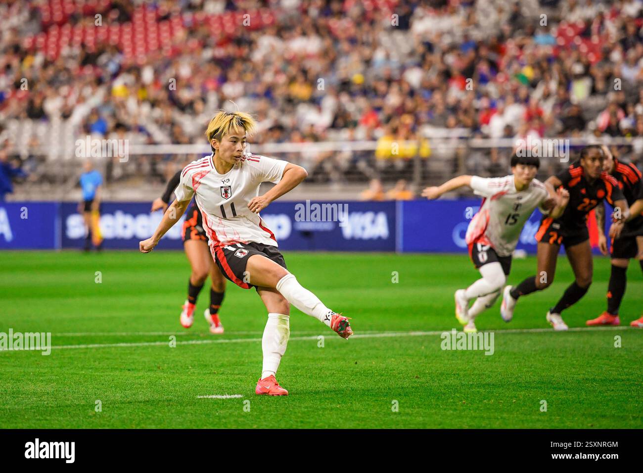 Japan forward Mina Tanaka (11) attempts shot on goal in the second half ...