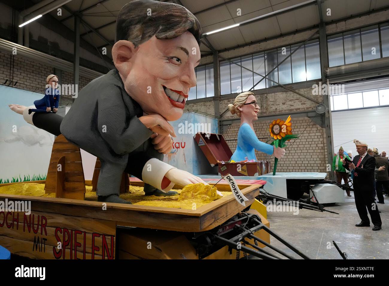 A carnival float depicts Elon Musk on a see-saw with German far-right ...