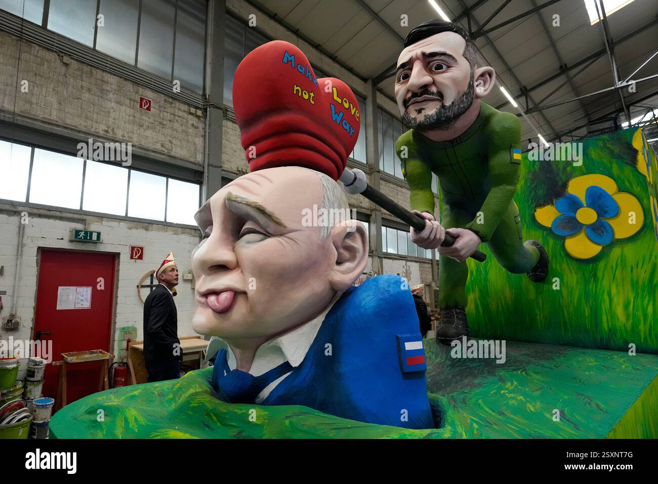 A carnival float depicts Ukraine President Volodymyr Zelenskyy hitting ...